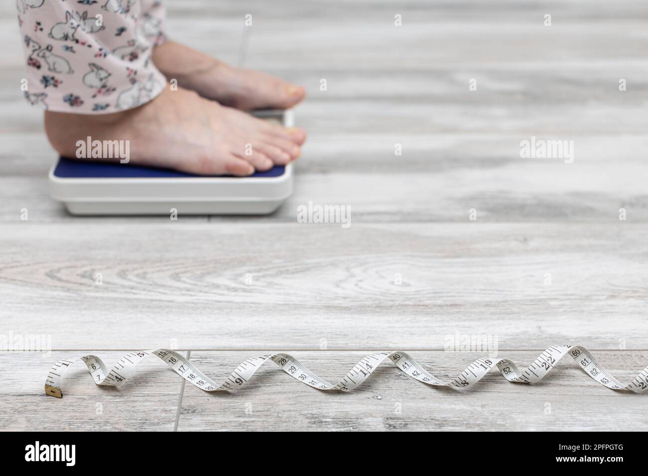 measuring tape taken with a shallow depth of field. measuring tape lies ...