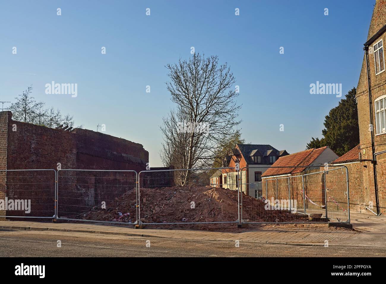 A pile of rubble is all that is left after an old building burnt down ...