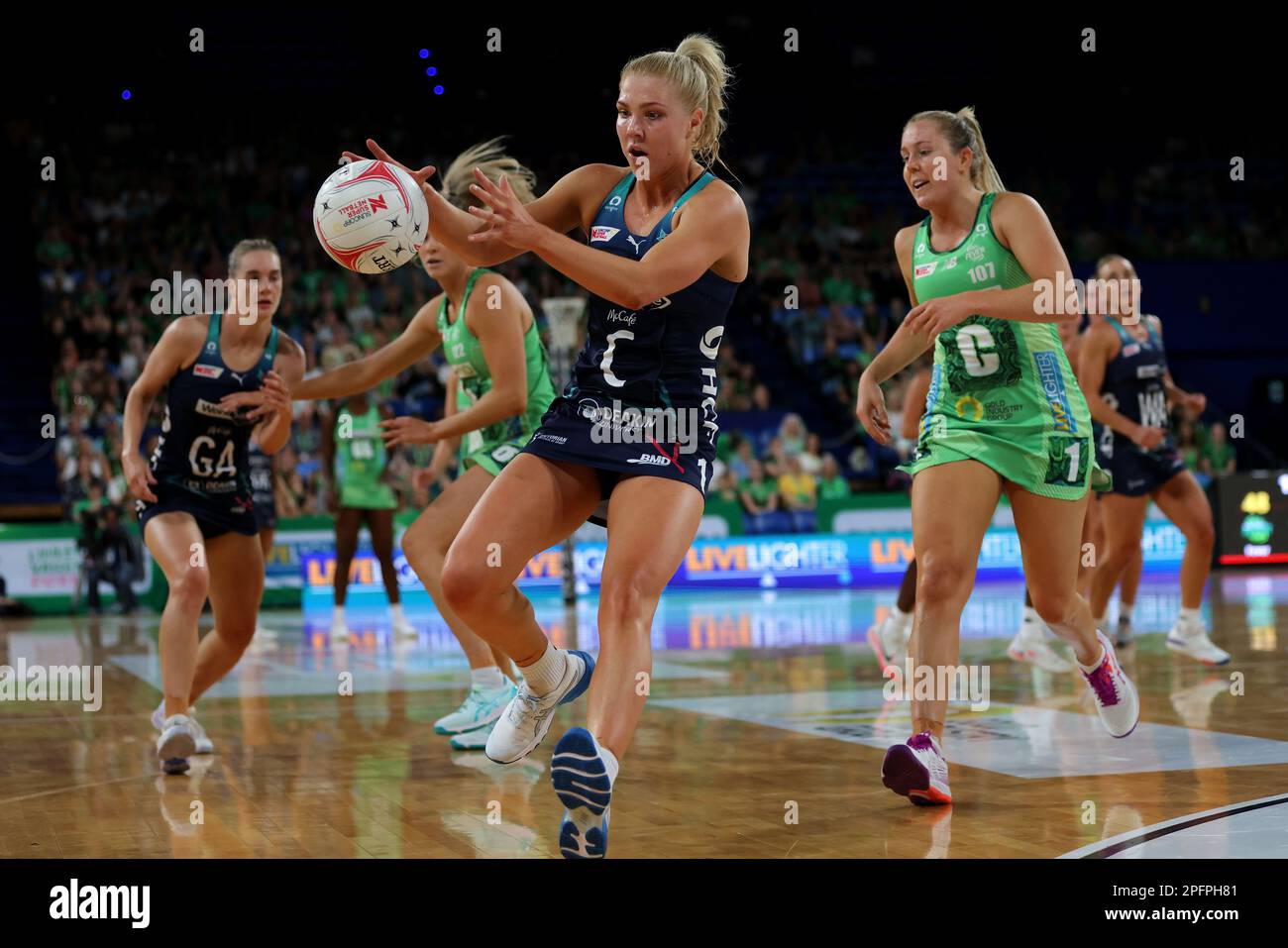 Kate Moloney of the Vixens receives the ball during the Super Netball ...