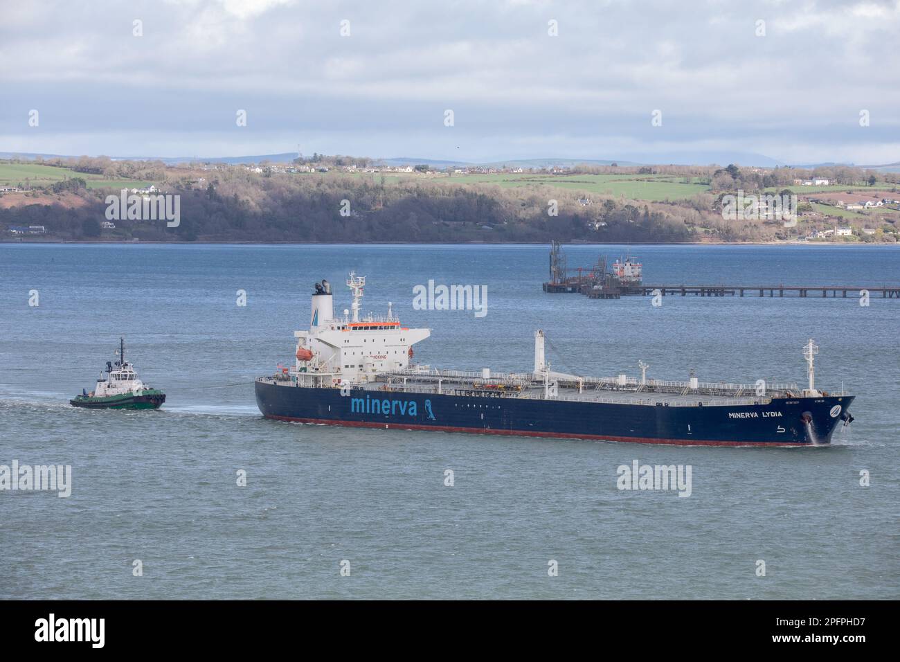 Whitegate, Cork, Ireland. 18th March, 2023. Tug Boat Alex escorts the ...