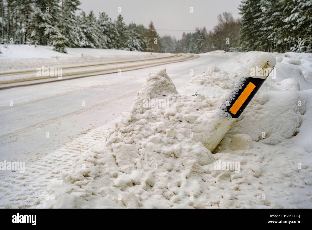 Road safety checkpoint on a winter day. Snow removal equipment damaged ...