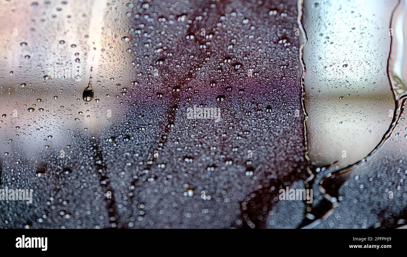 Car window glass after washing. It is covered with water droplets on ...