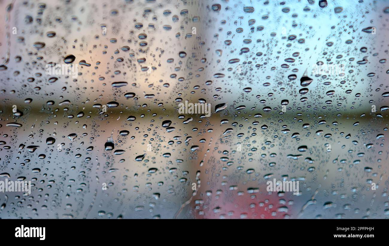 Car window glass after washing. It is covered with water droplets on ...