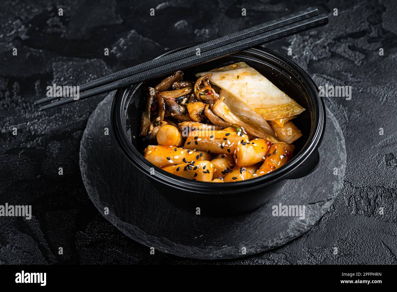 Korean street food Tteokbokki, Topokki fried rice cake stick in spicy ...