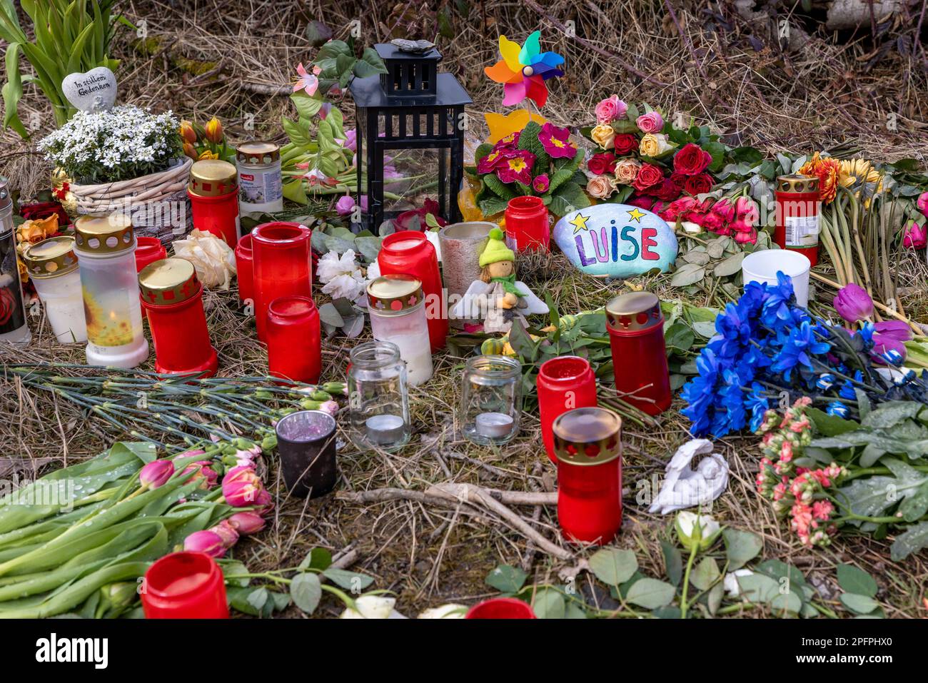 Freudenberg, Germany. 18th Mar, 2023. Candles, flowers, cuddly toys and ...