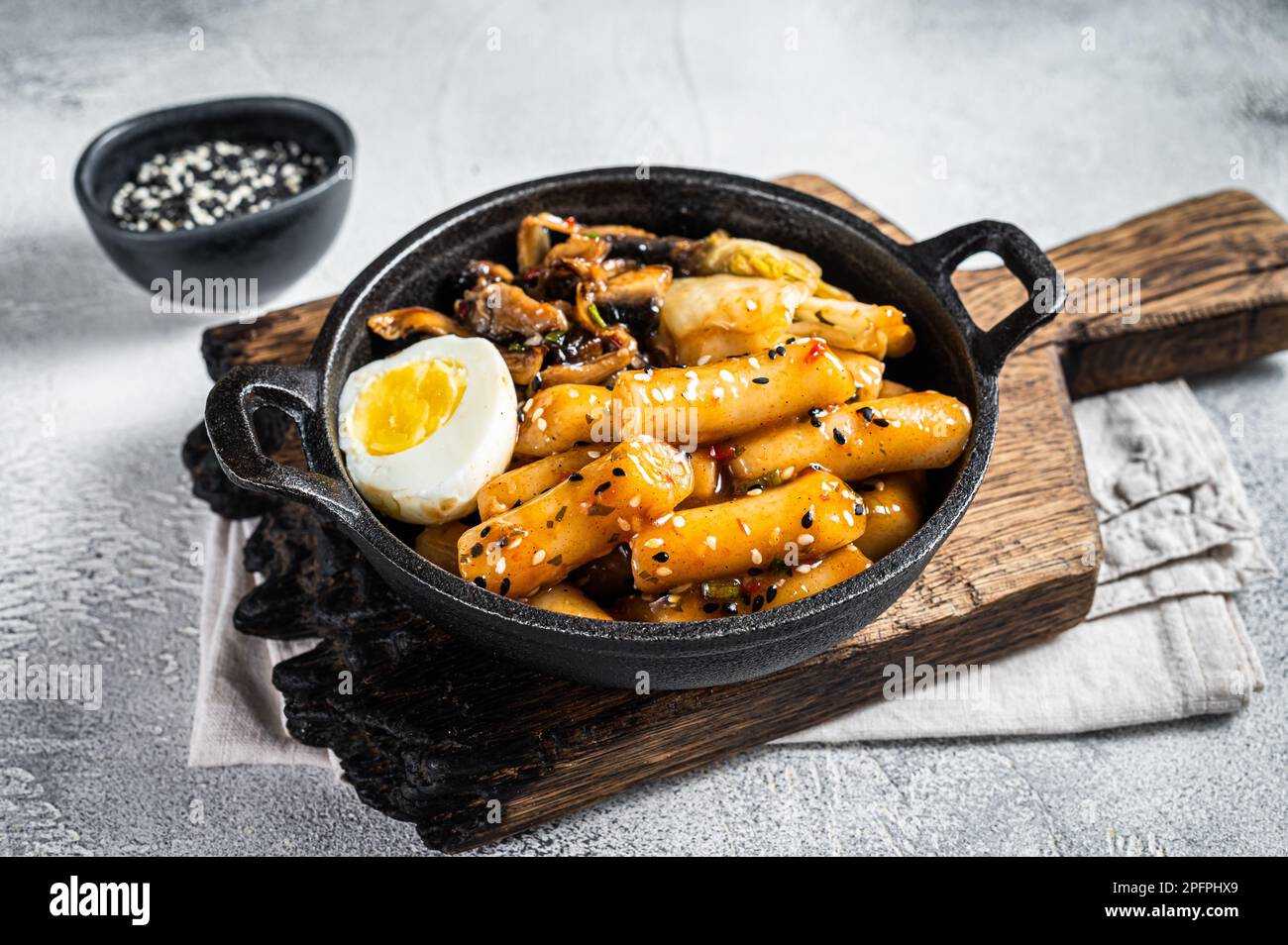 Tteokbokki, Topokki stick rice cake in spicy sauce with egg and ...