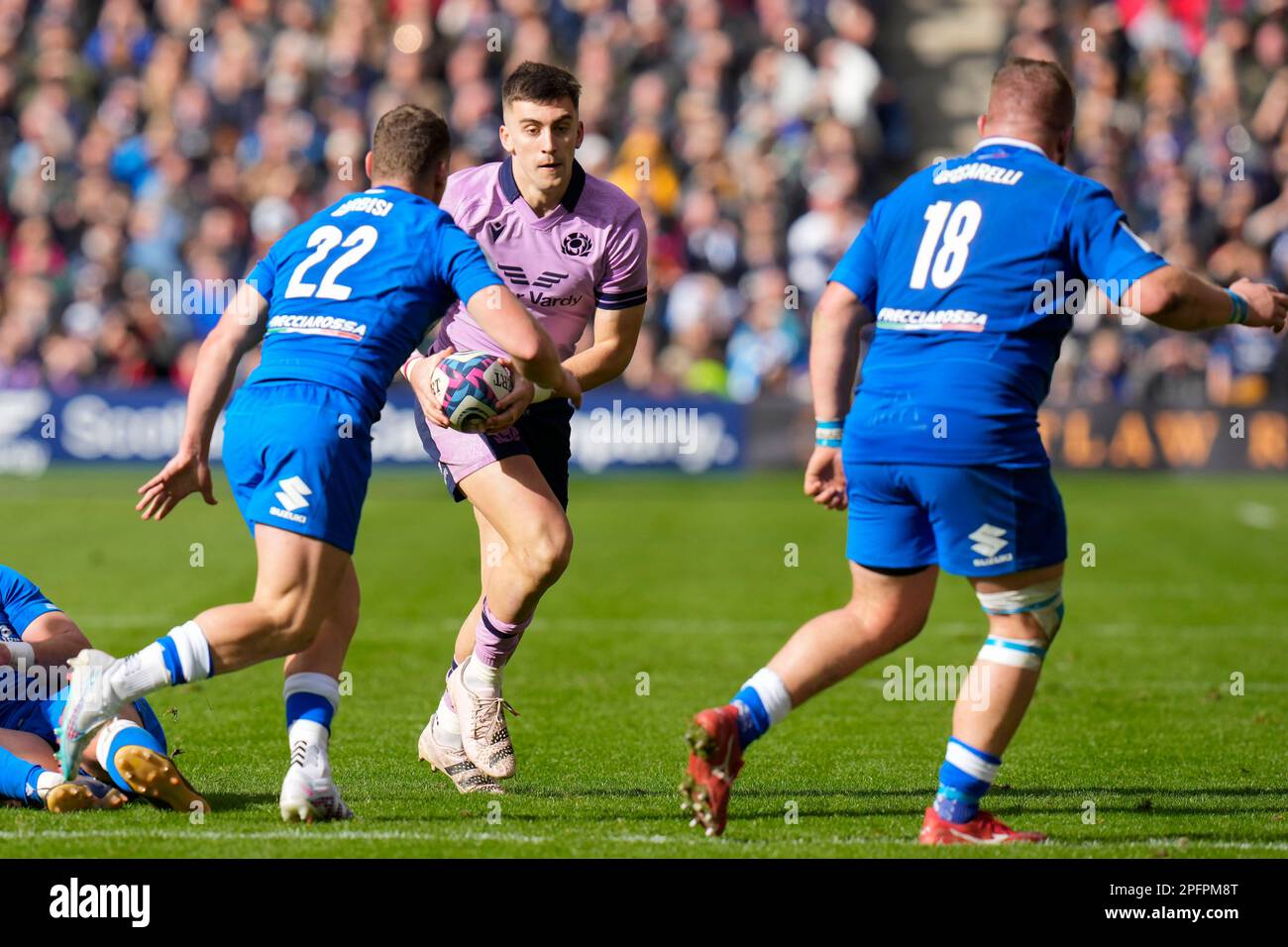 Cameron Redpath #23 of Scotland runs at. The Italian defence during the ...