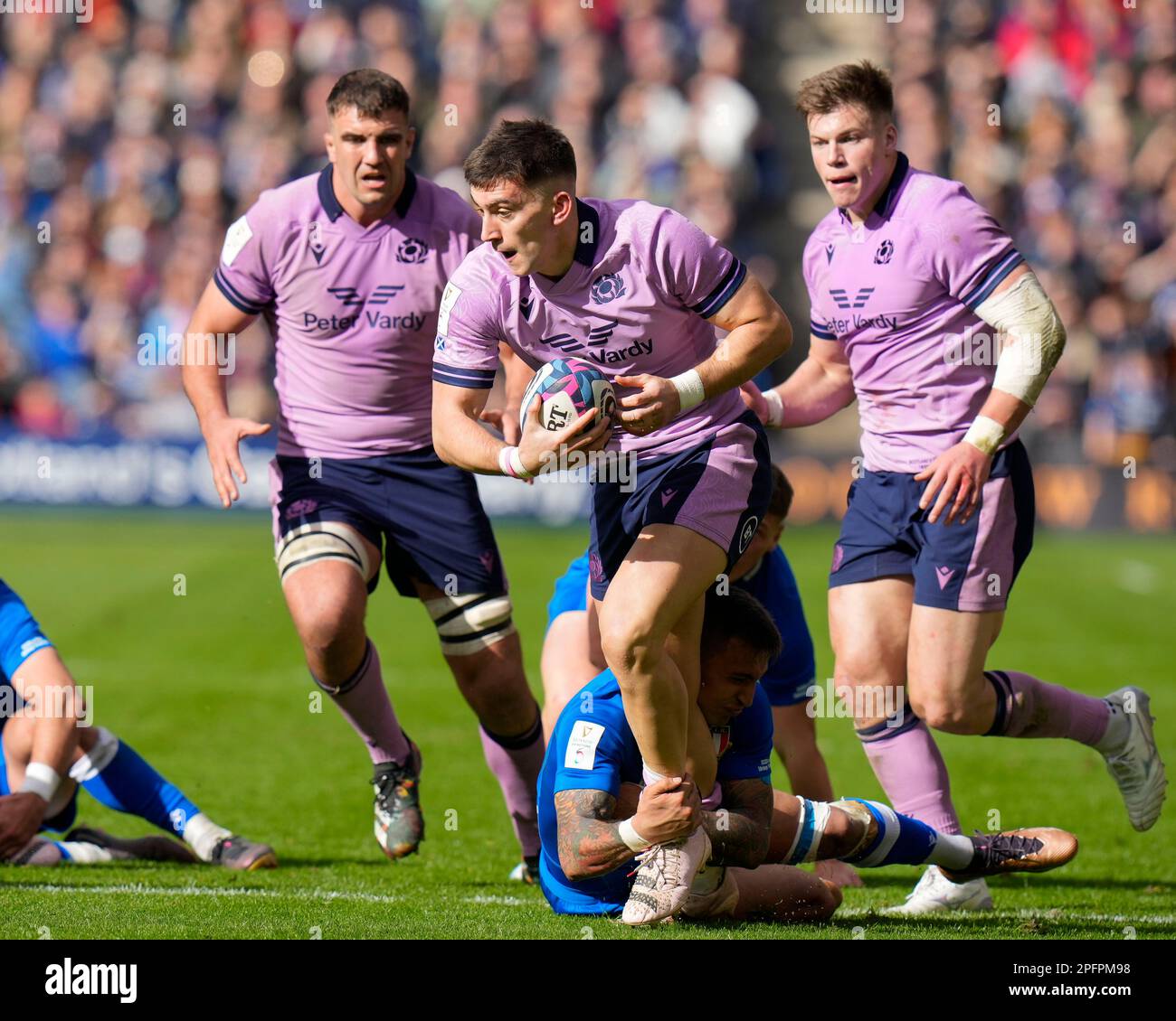 Cameron Redpath #23 of Scotland runs at. The Italian defence during the ...