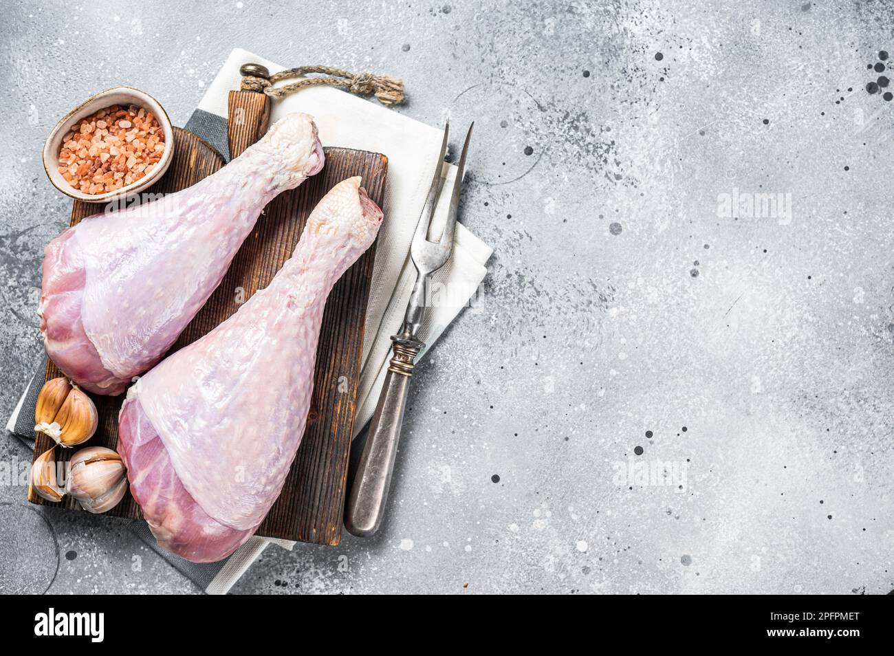 Raw turkey legs, Poultry meat. Gray background. Top view. Copy space ...