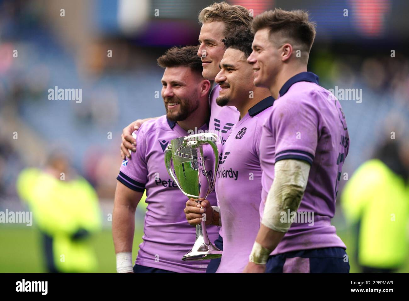 Scotland's Sione Tuipulotu (centre) with the Cuttitta Cup and team ...