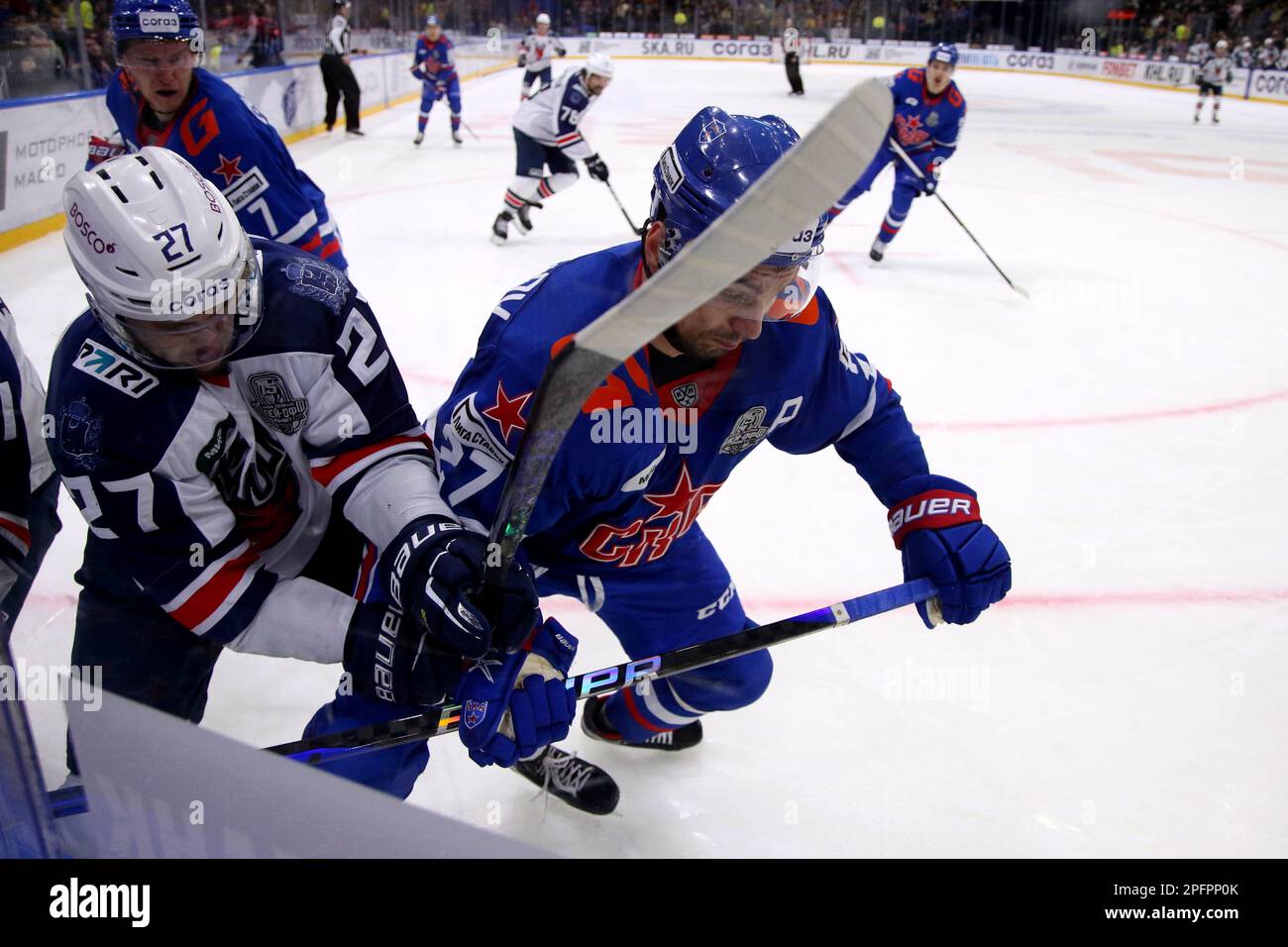 SKA Hockey Club player, Igor Ozhiganov (No.27) and Torpedo Hockey Club ...