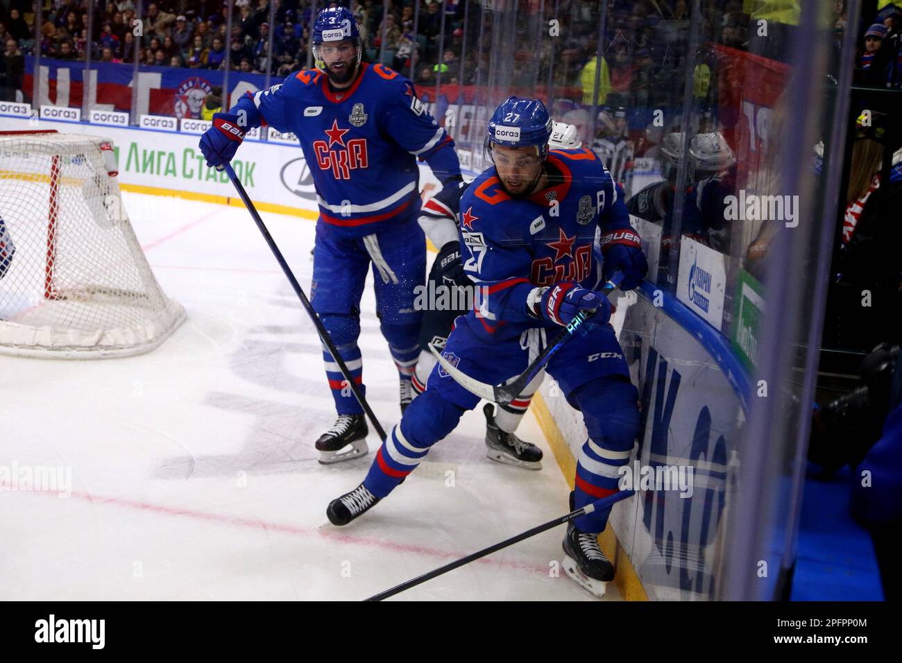 SKA Hockey Club player, Igor Ozhiganov (No.27) and Torpedo Hockey Club ...