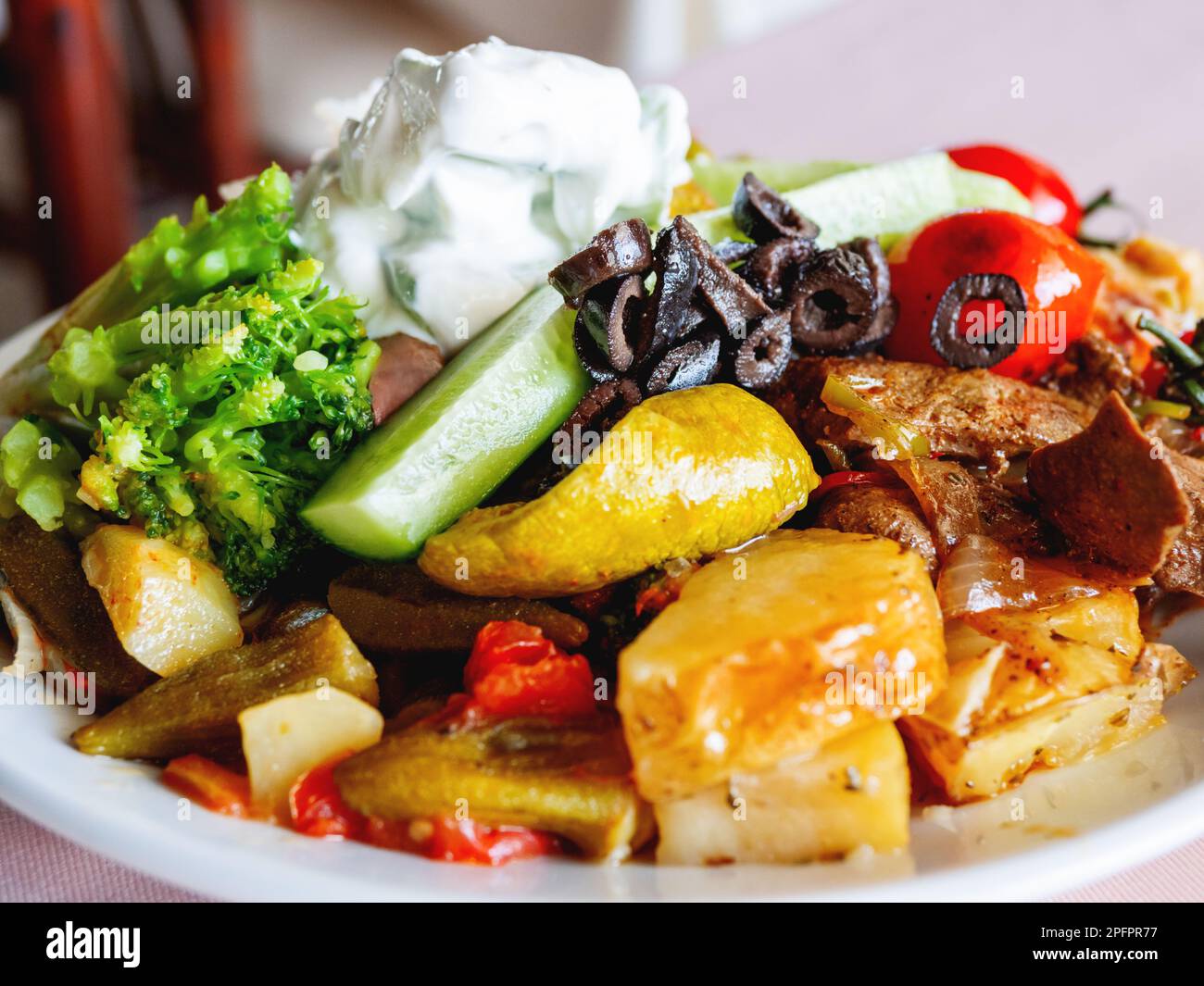 Healthy dinner - plate full of stewed vegetables, rice and meat with ...