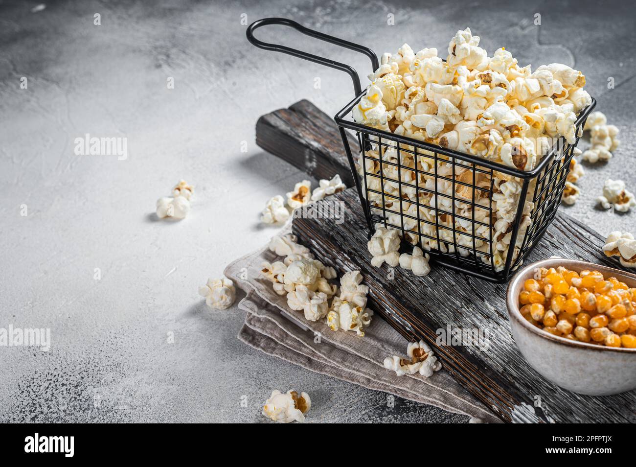 Homemade Buttered cheese popcorn in a basket. White background. Top ...