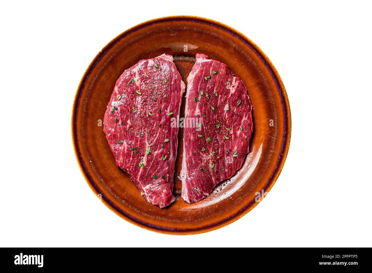 Raw rump cap steak or top sirloin steak in rustic plate with thyme and ...