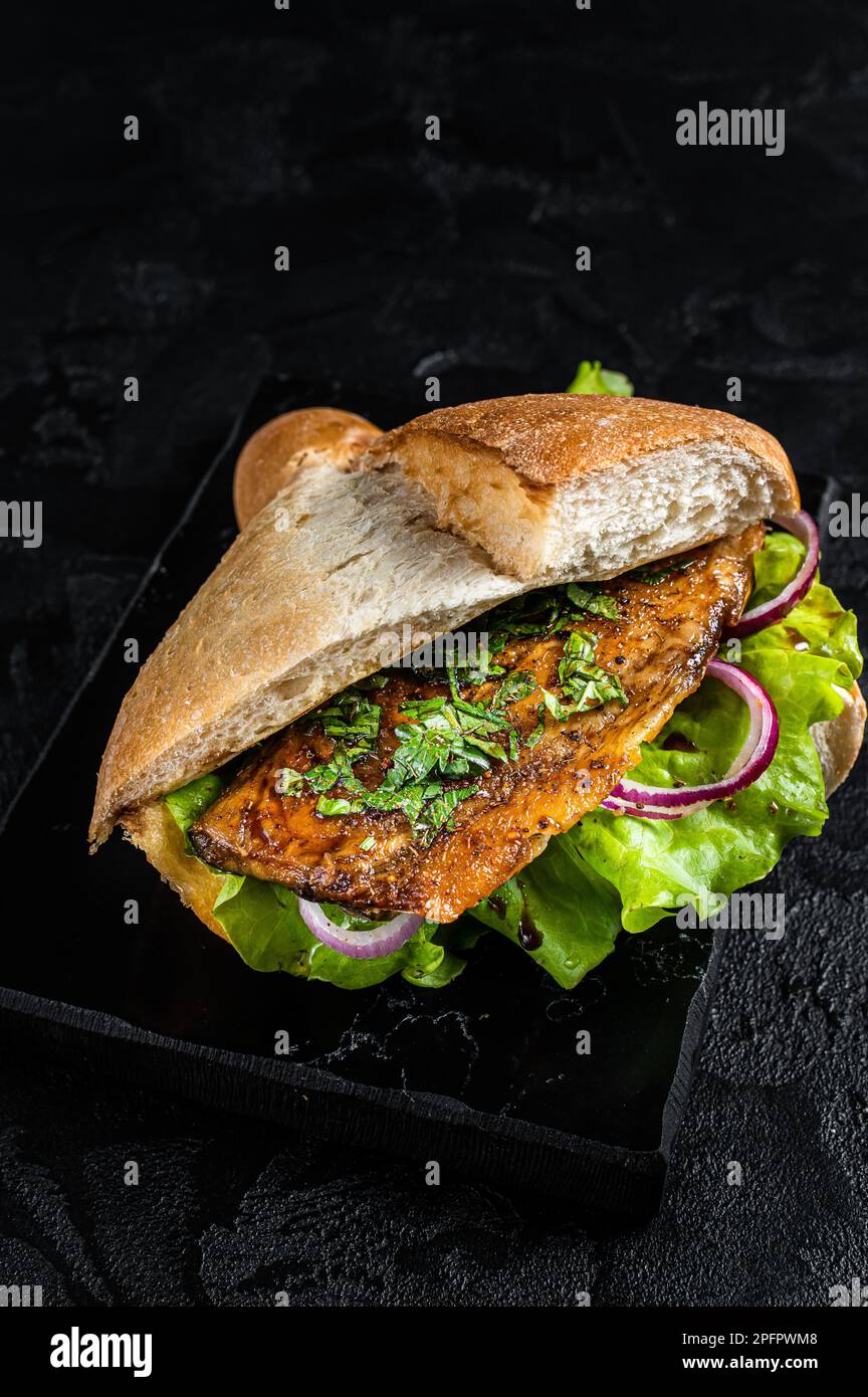 Turkish fish sandwich with grilled mackerel fillet Balik Ekmek. Black ...