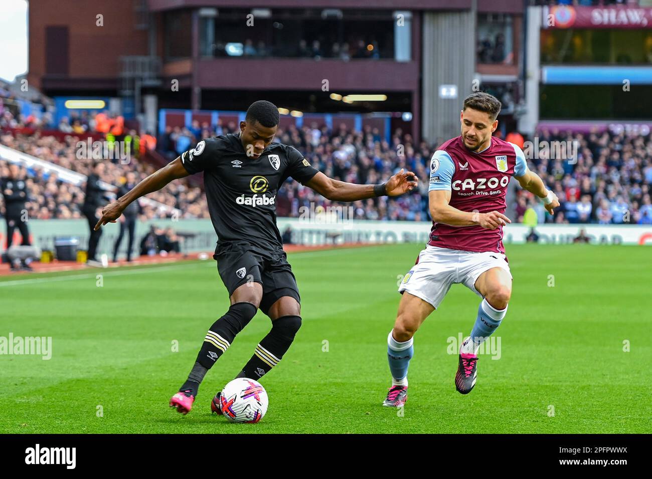 Alex Moreno #15 of Aston Villa tries to block a cross from Dango Ouattara #11 of Bournemouth ...