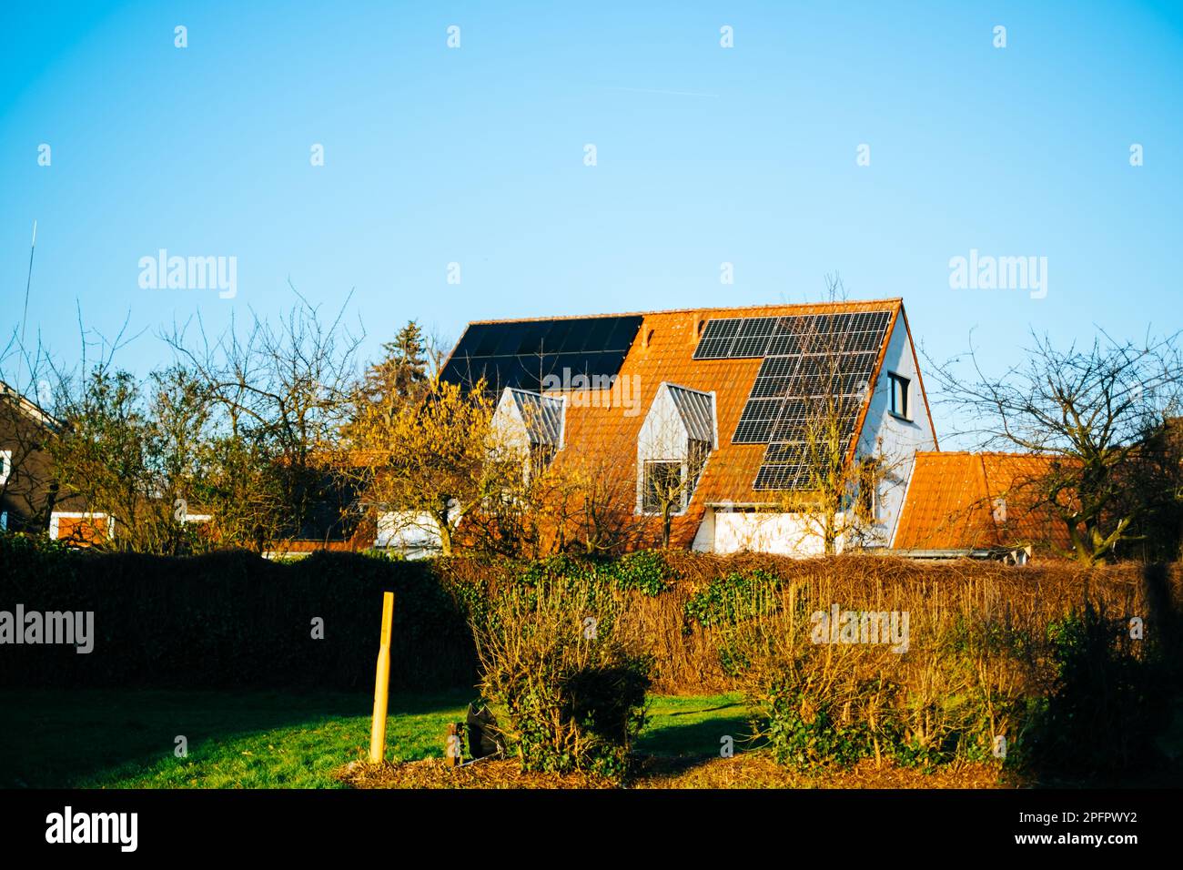 Modern home with installed solar panels. Sun energy source to produce ...