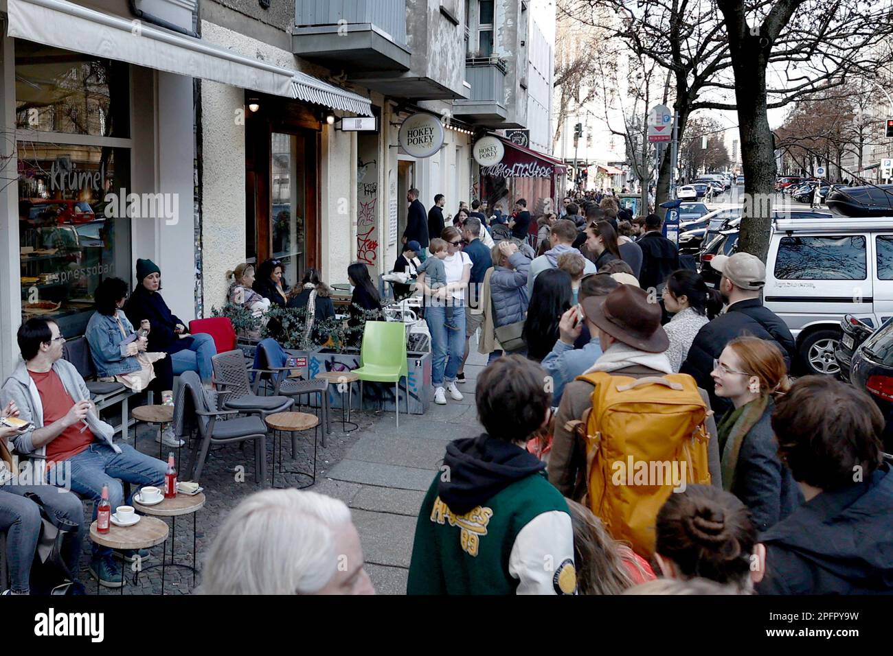Berlin, Germany. 18th Mar, 2023. People stand in a long line in front ...