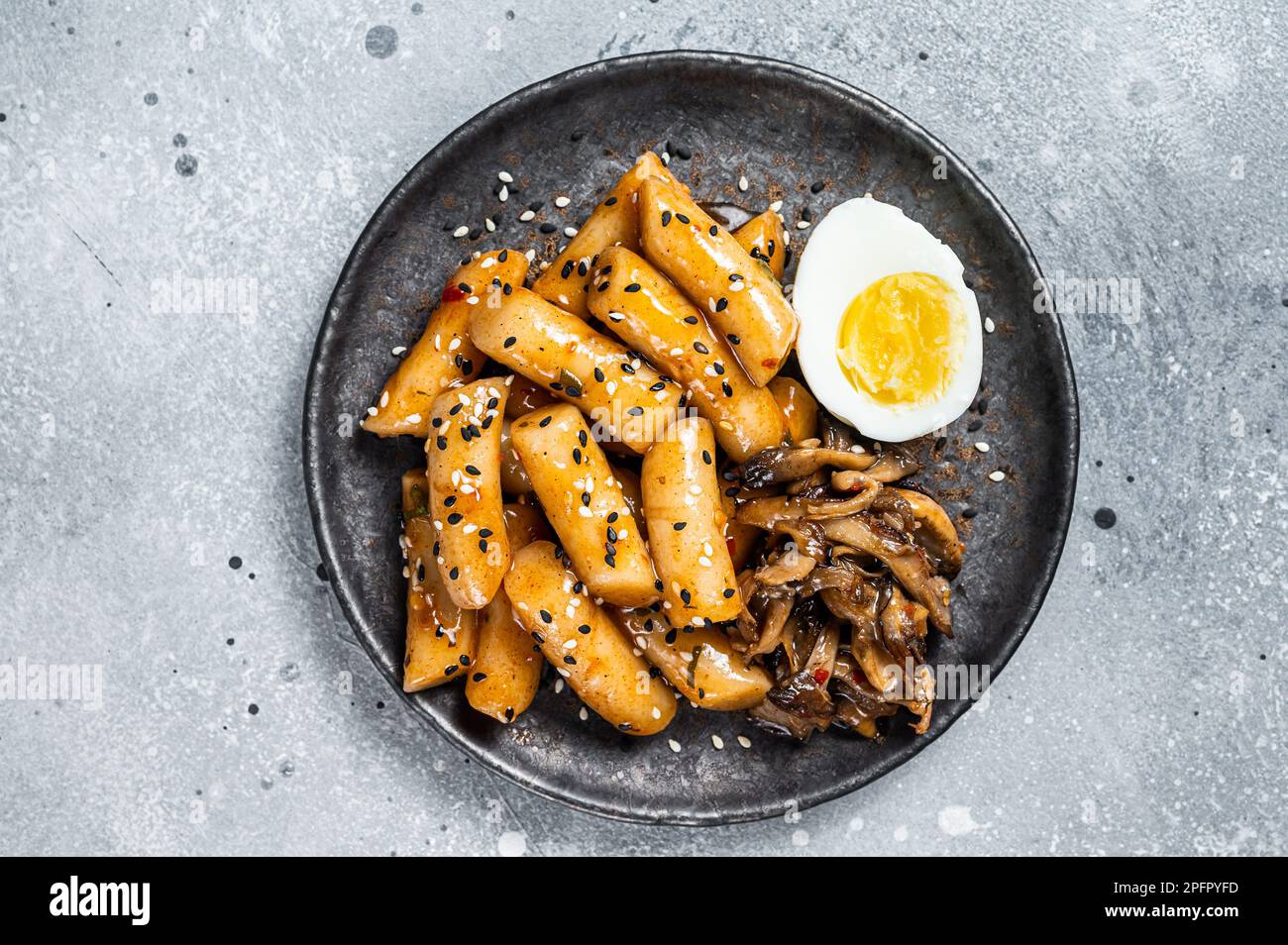 Korean Tteokbokki, Topokki fried rice cake stick in Hot and spicy sauce ...