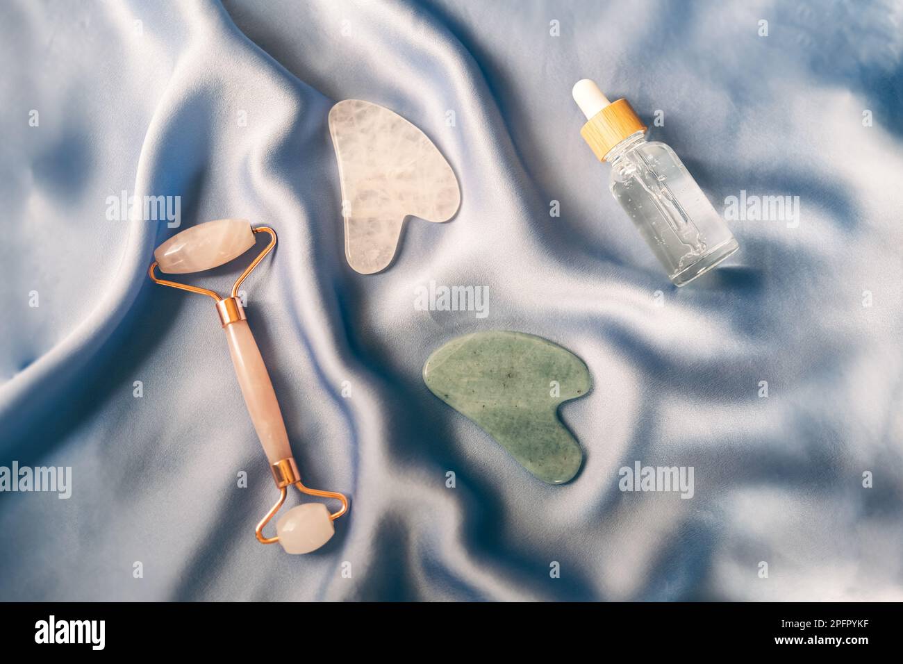 Natural stone gua sha tools for facial acupuncture massage Stock Photo ...