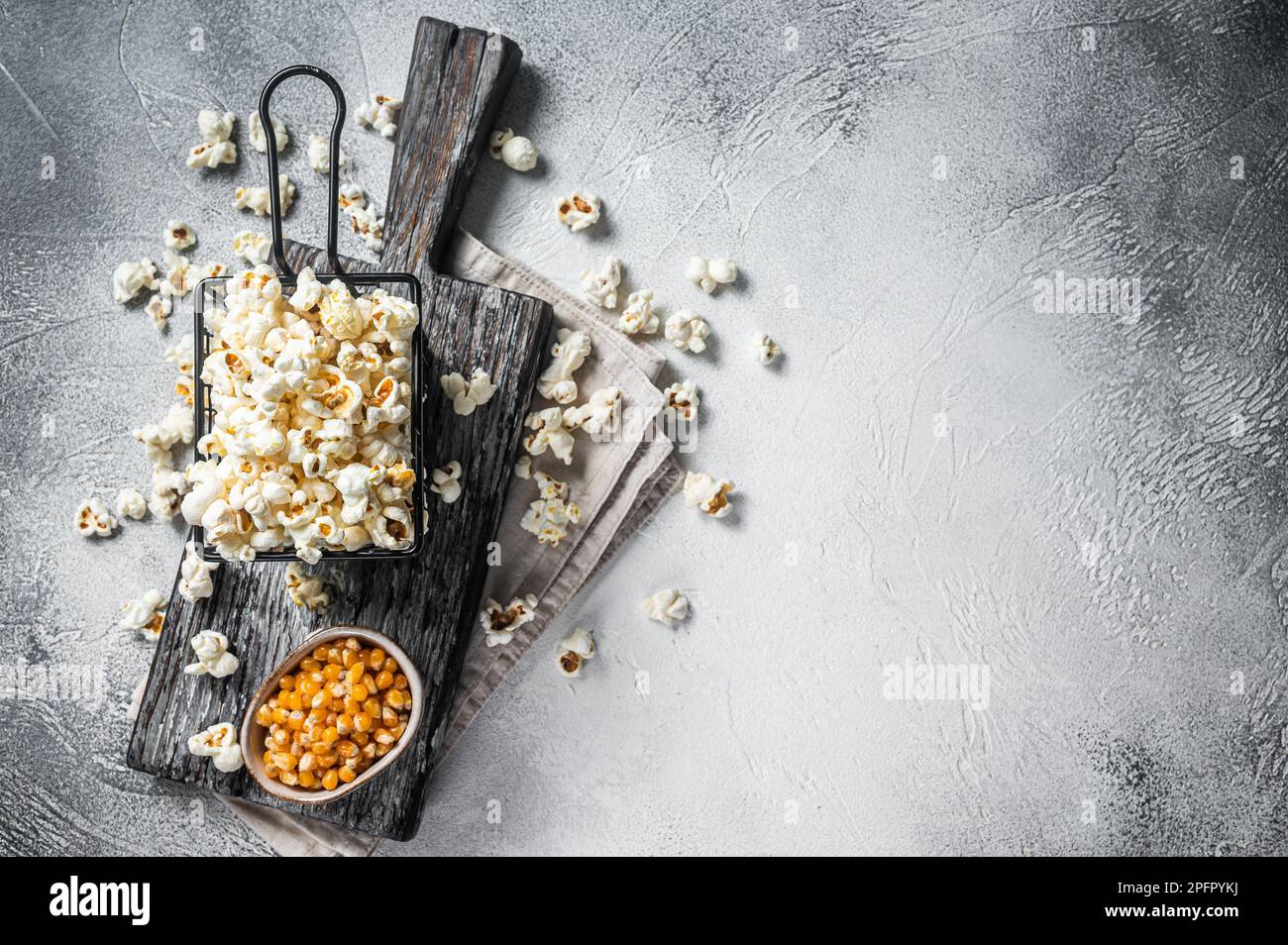 Homemade Buttered cheese popcorn in a basket. White background. Top ...