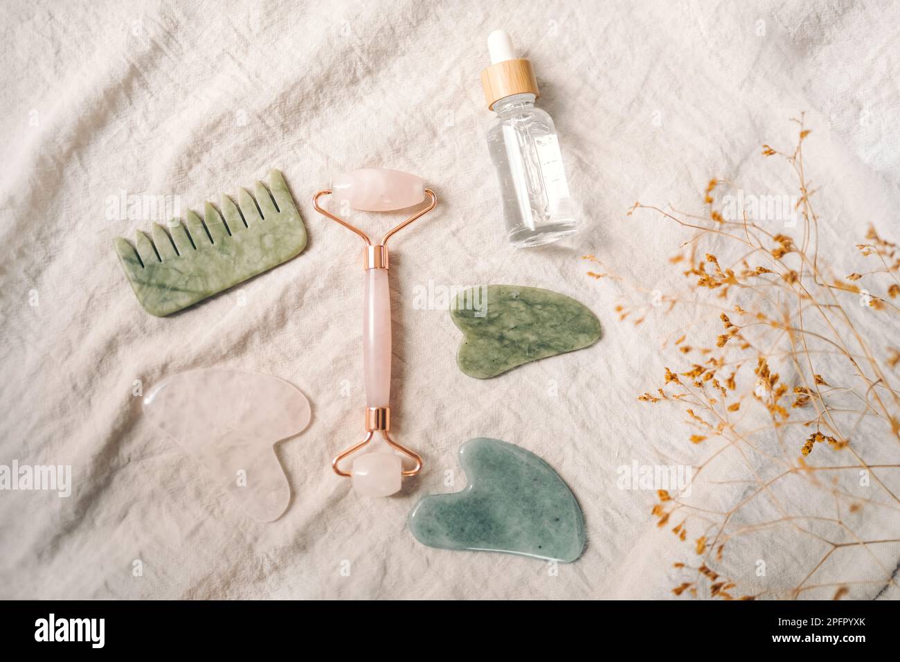 Natural stone gua sha tools for facial acupuncture massage Stock Photo ...