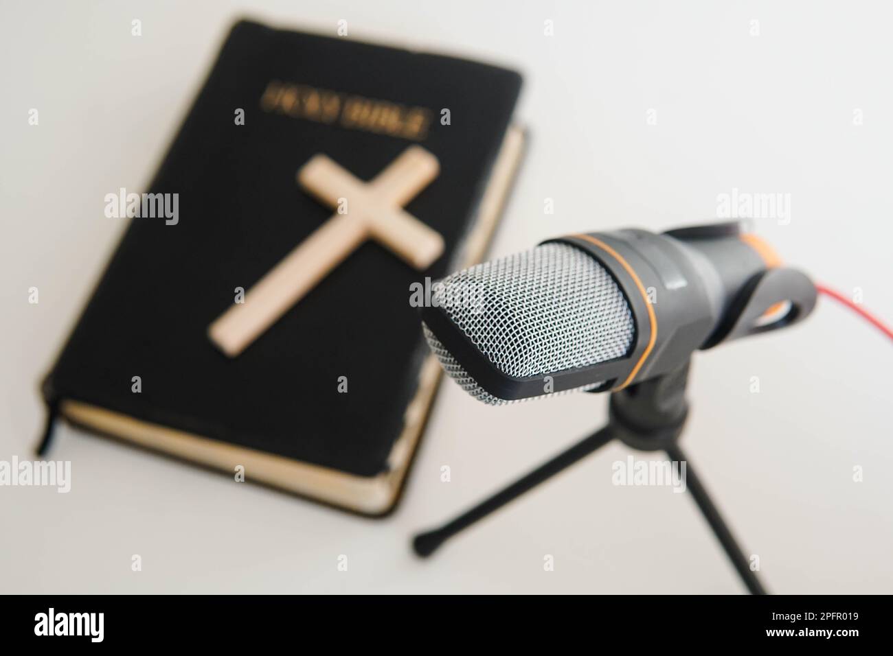 Bible book with microphone on table. Christian radio broadcast. Man ...