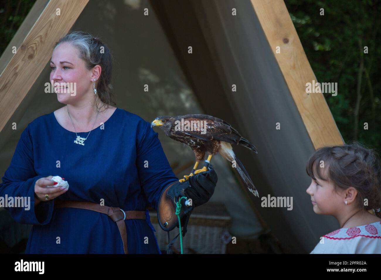 Woman holding falcon hi-res stock photography and images - Alamy