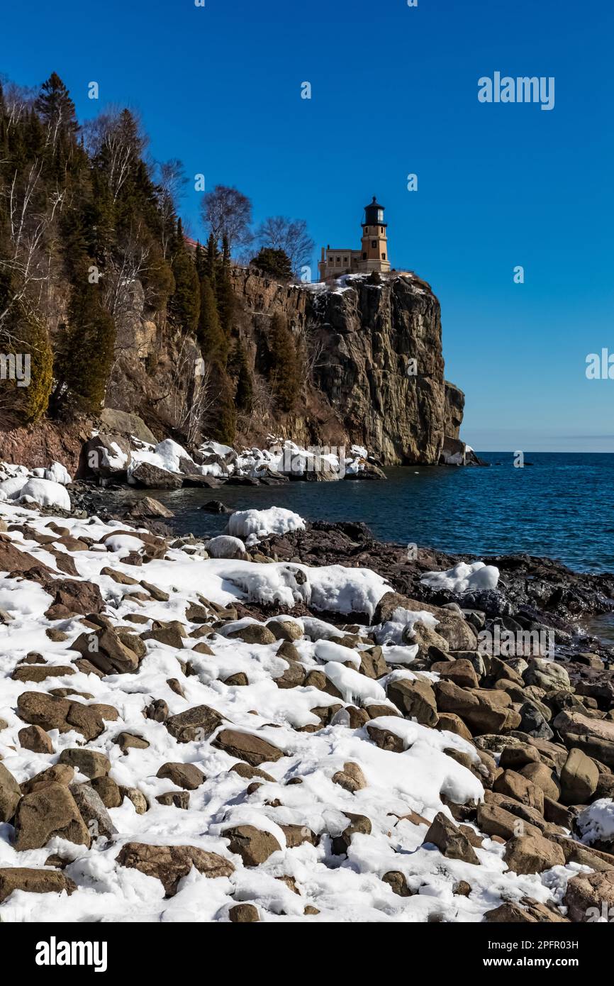 Ice left by water splashed up from waves below Split Rock Lighthouse on ...