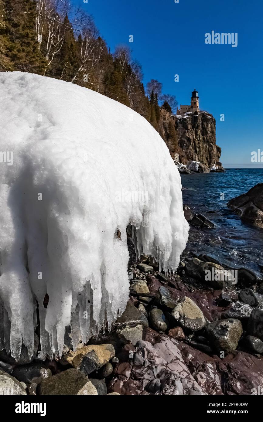Ice left by water splashed up from waves below Split Rock Lighthouse on ...