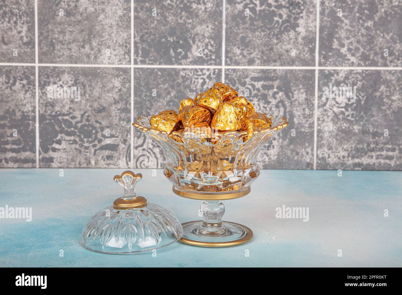 Chocolates wrapped in foil in luxury candy. Chocolate candies in a box ...