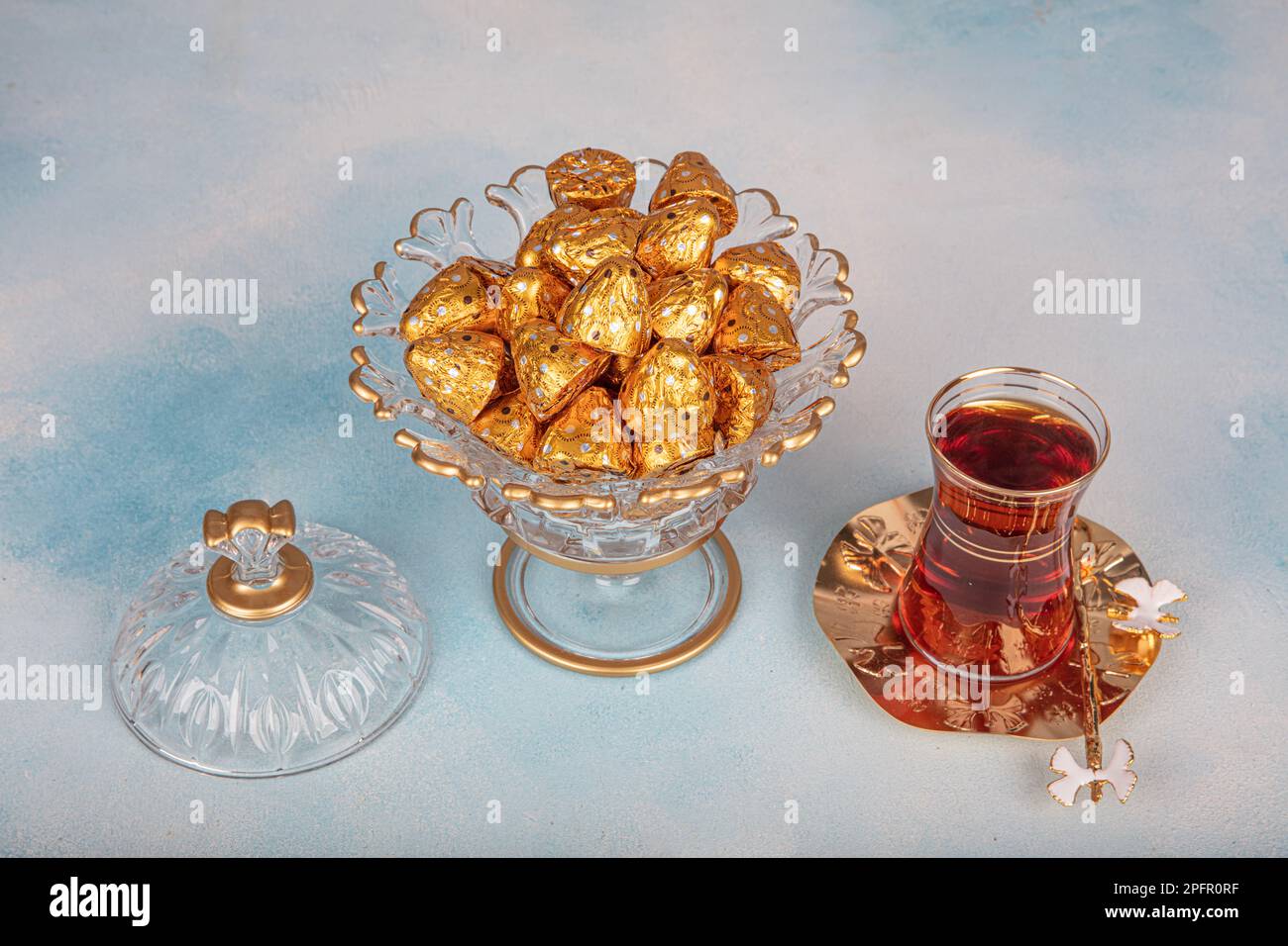 Chocolates wrapped in foil in luxury candy. Chocolate candies in a box ...