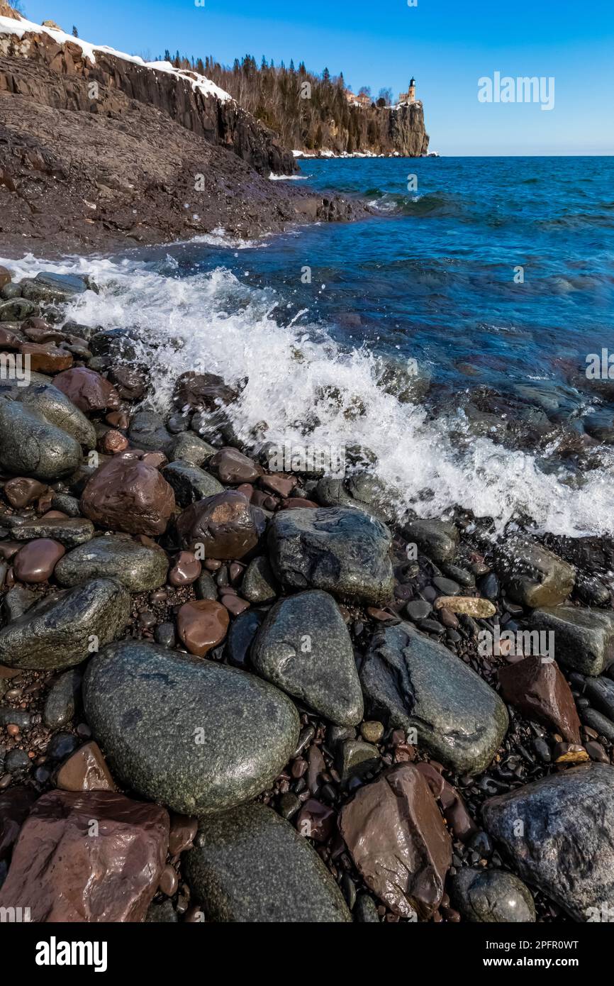 Waves coming ashore on the cobble beach below Split Rock Lighthouse on ...