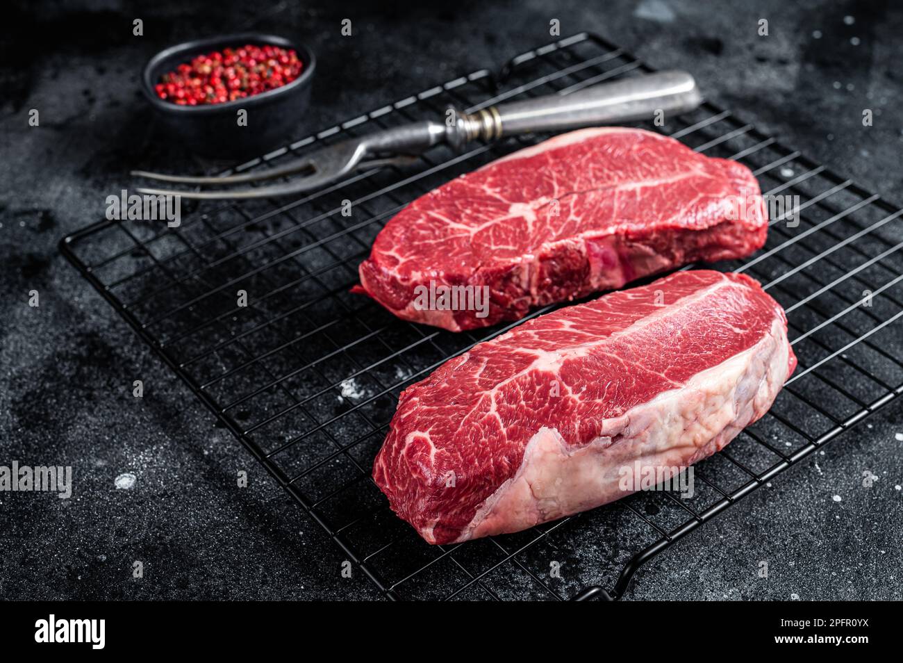 Raw top blade cut organic beef meat. Black background. Top View Stock ...