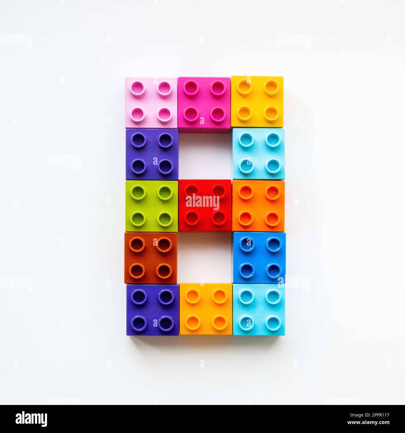 Number Eight made of colorful constructor blocks. Toy bricks lying in ...