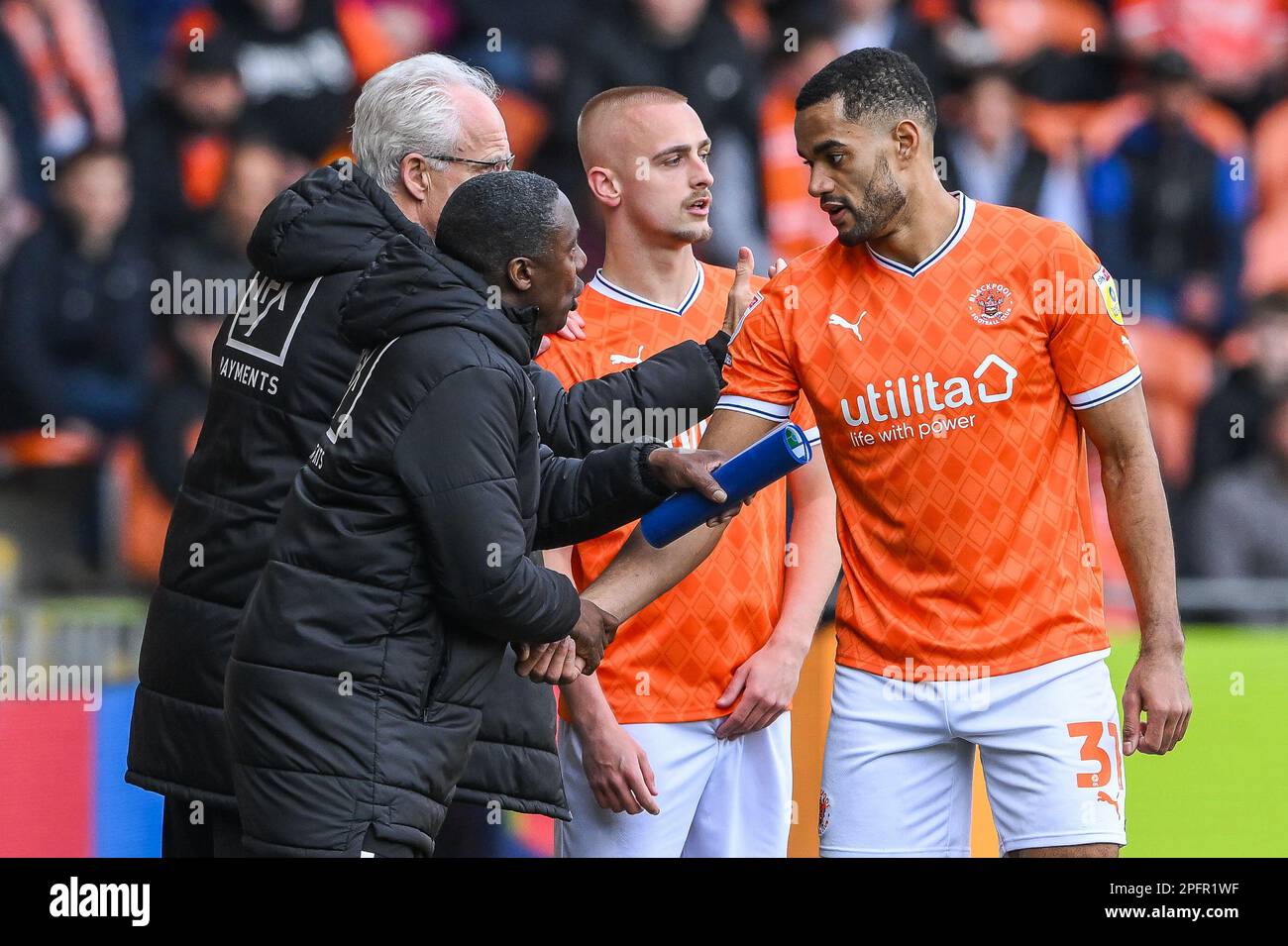 Mick McCarthy Manager of Blackpool speaks to Curtis Nelson #31 during a ...