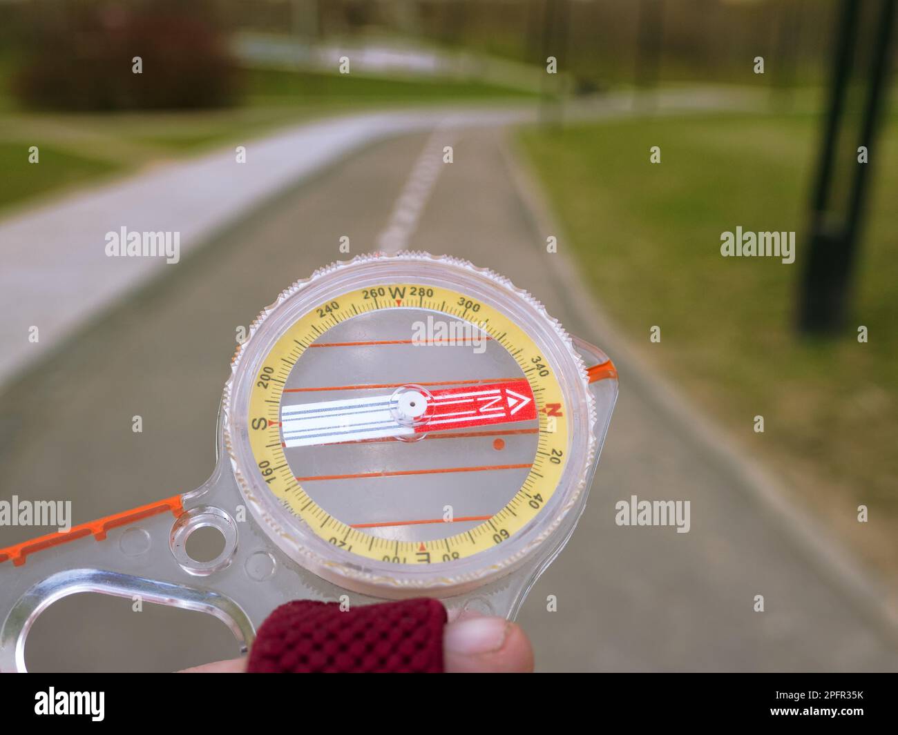 A compass in a person's hand. Orient yourself in the current situation ...