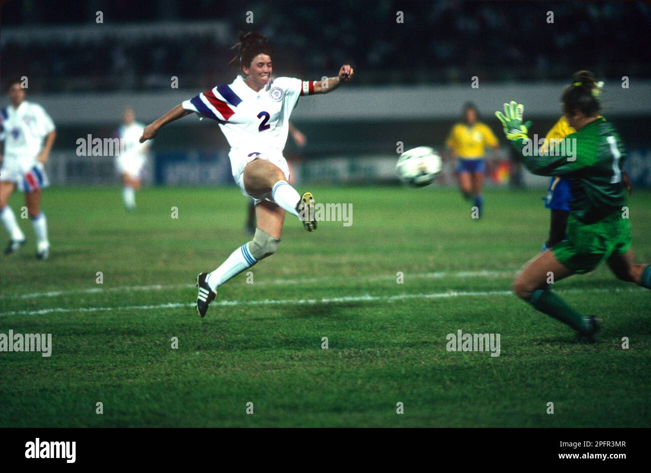 US Captain, April Heinrichs, moments before she nets a goal in the ...