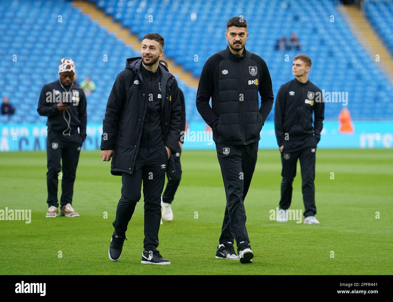 Burnley's Halil Dervisoglu (left) and Arijanet Muric inspect the pitch ...