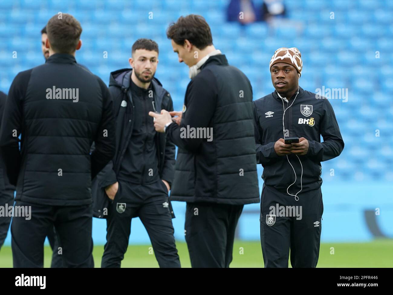 Burnley's Michael Obafemi (right) inspecting the pitch before the ...