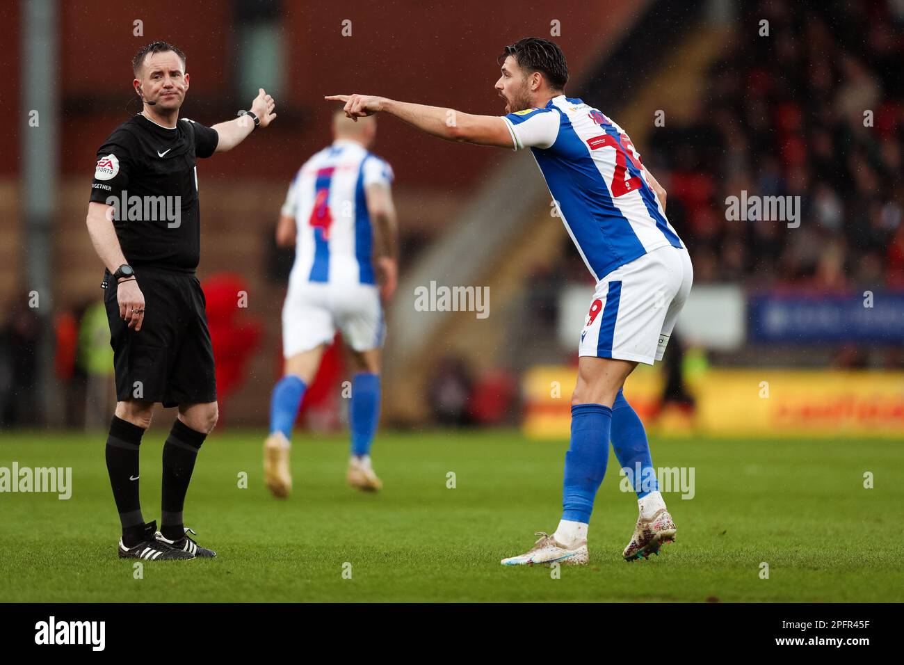 Colchester United's Connor Hall protests against a decision made by ... Colchester United's Connor Hall protests against a decision made by ...