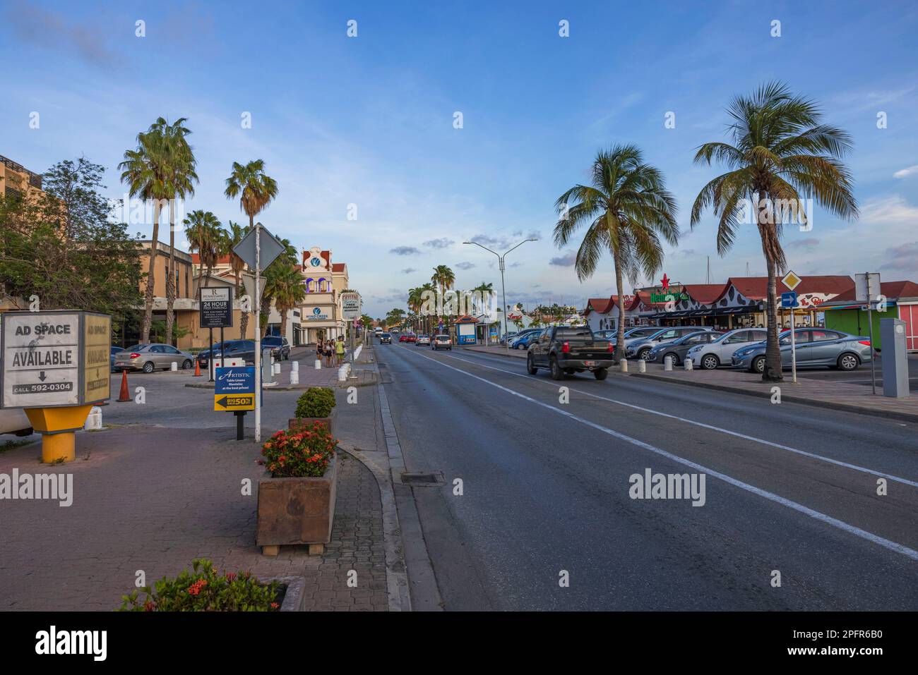 Beautiful view of highway in downtown city of Oranjestad with passing ...