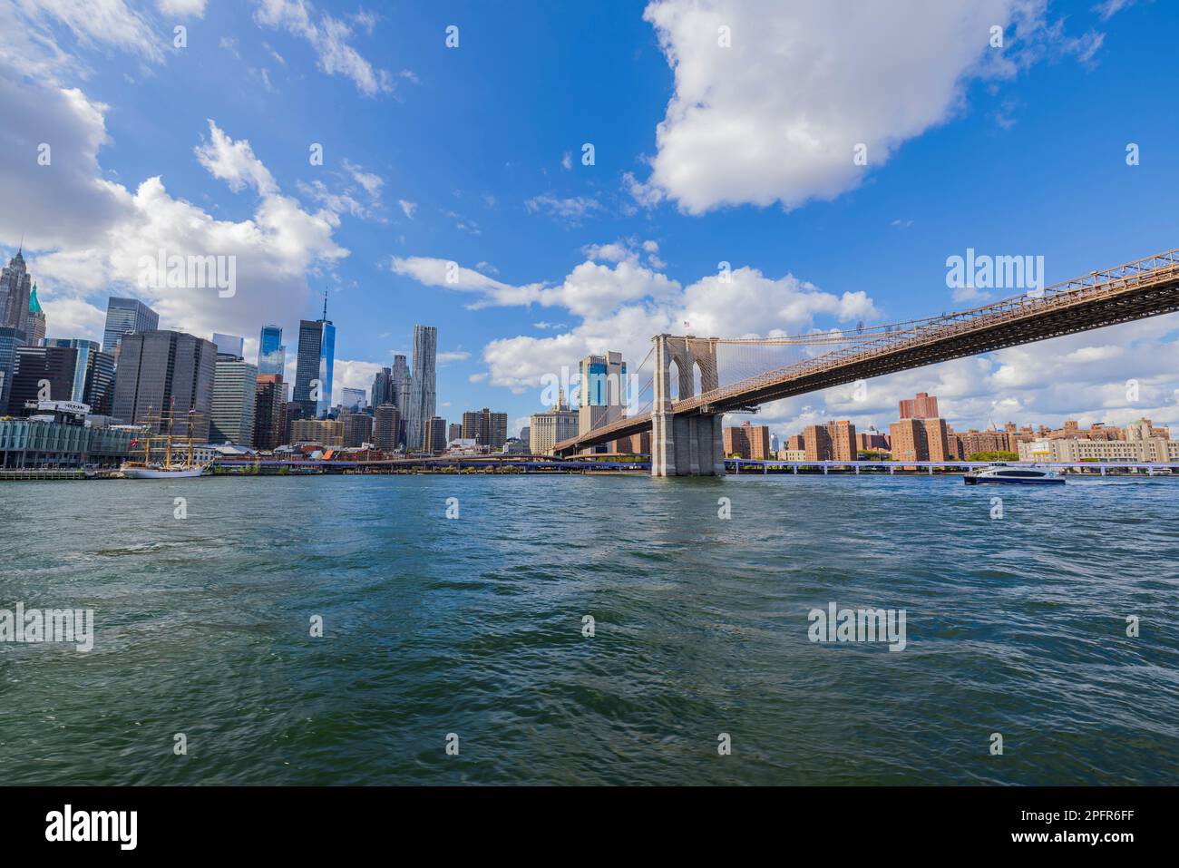 Beautiful panoramic view of Brooklyn Bridge over Hudson River and skyscrapers of Manhattan on ...