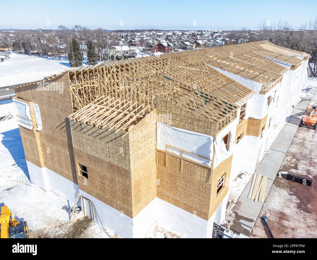 Aerial drone view of a multifamily apartment complex under construction ...
