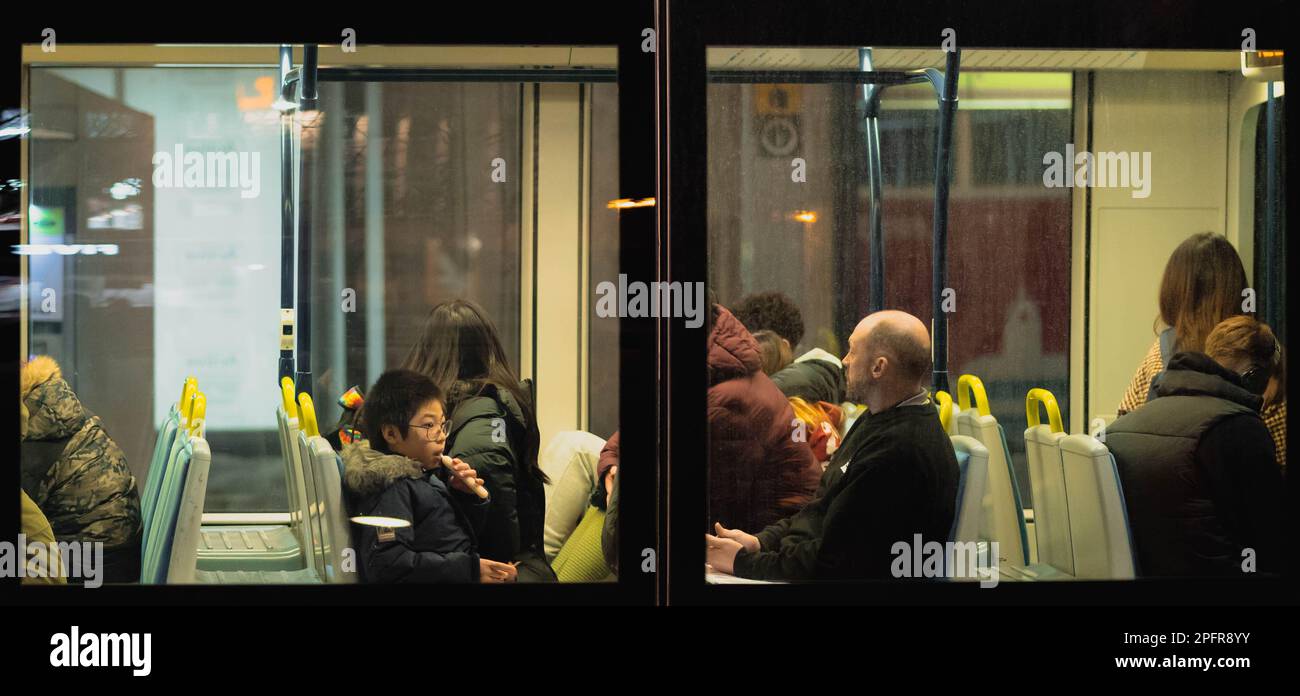 A close-up shot of passengers sitting on seats inside a train Stock ...
