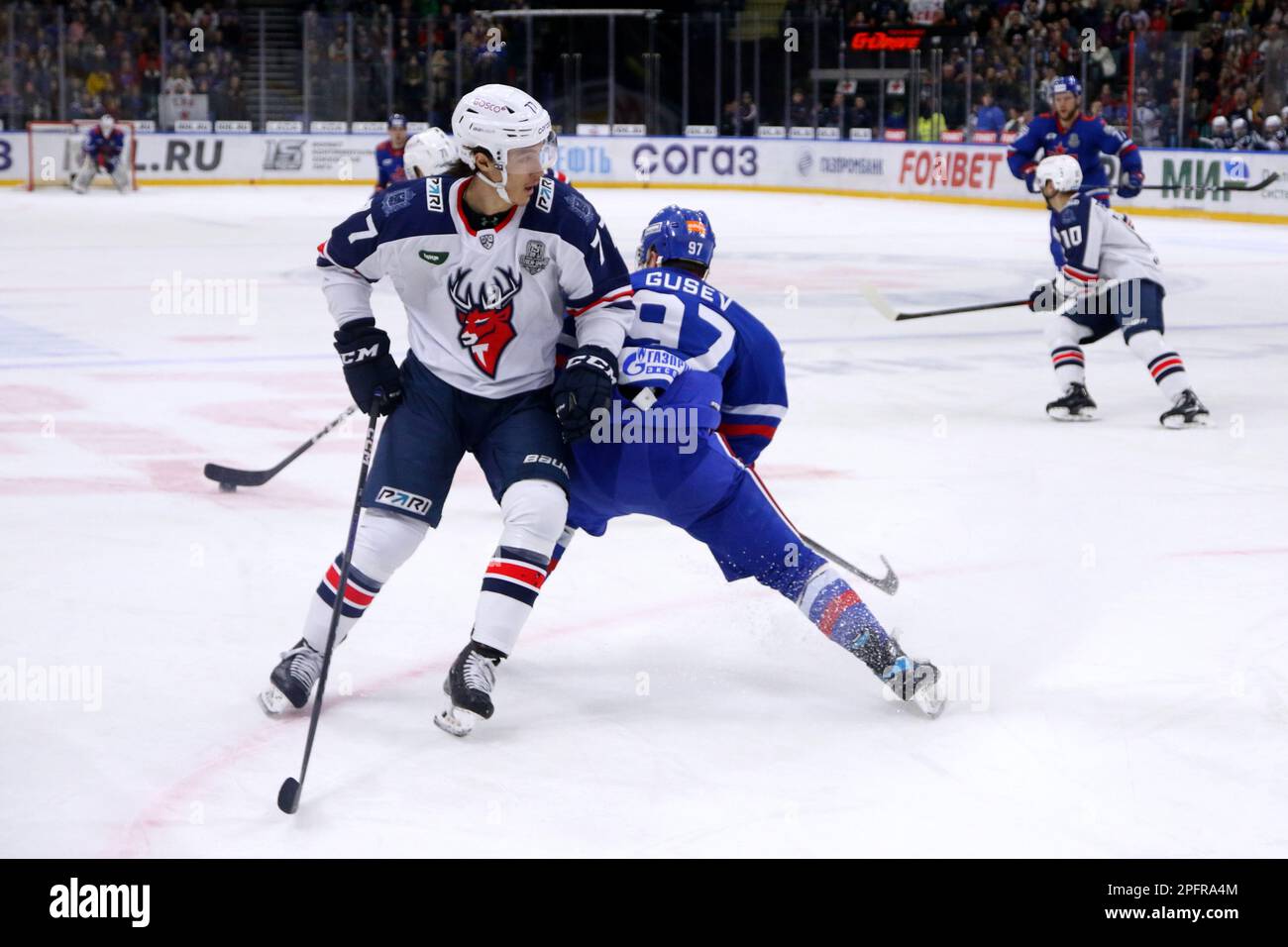 SKA Hockey Club player, Nikita Gusev (No.97) and Torpedo Hockey Club player, Denis Yan (No.77 ...