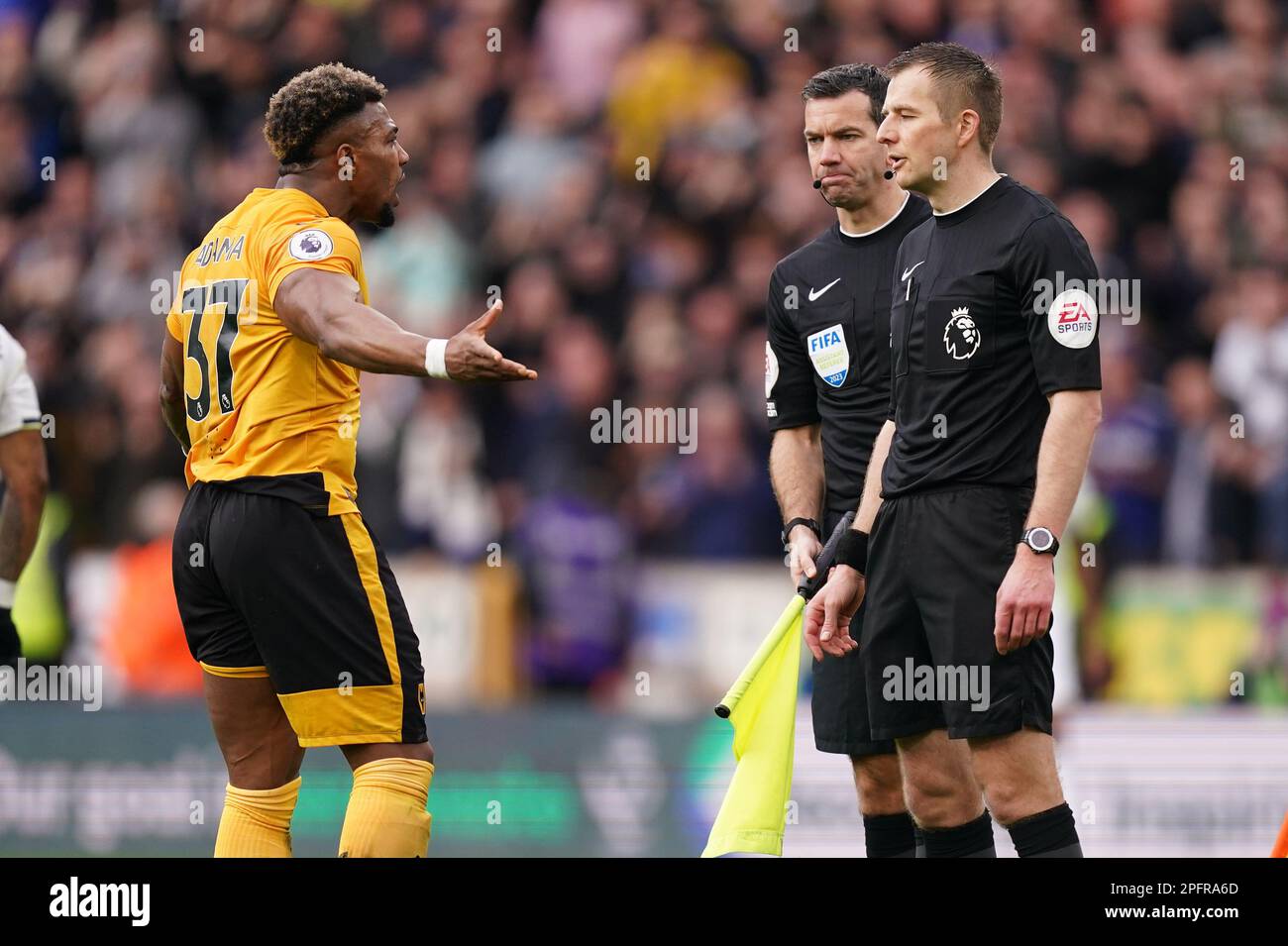 Wolverhampton Wanderers' Adama Traore (left) speaks to referee Michael ...