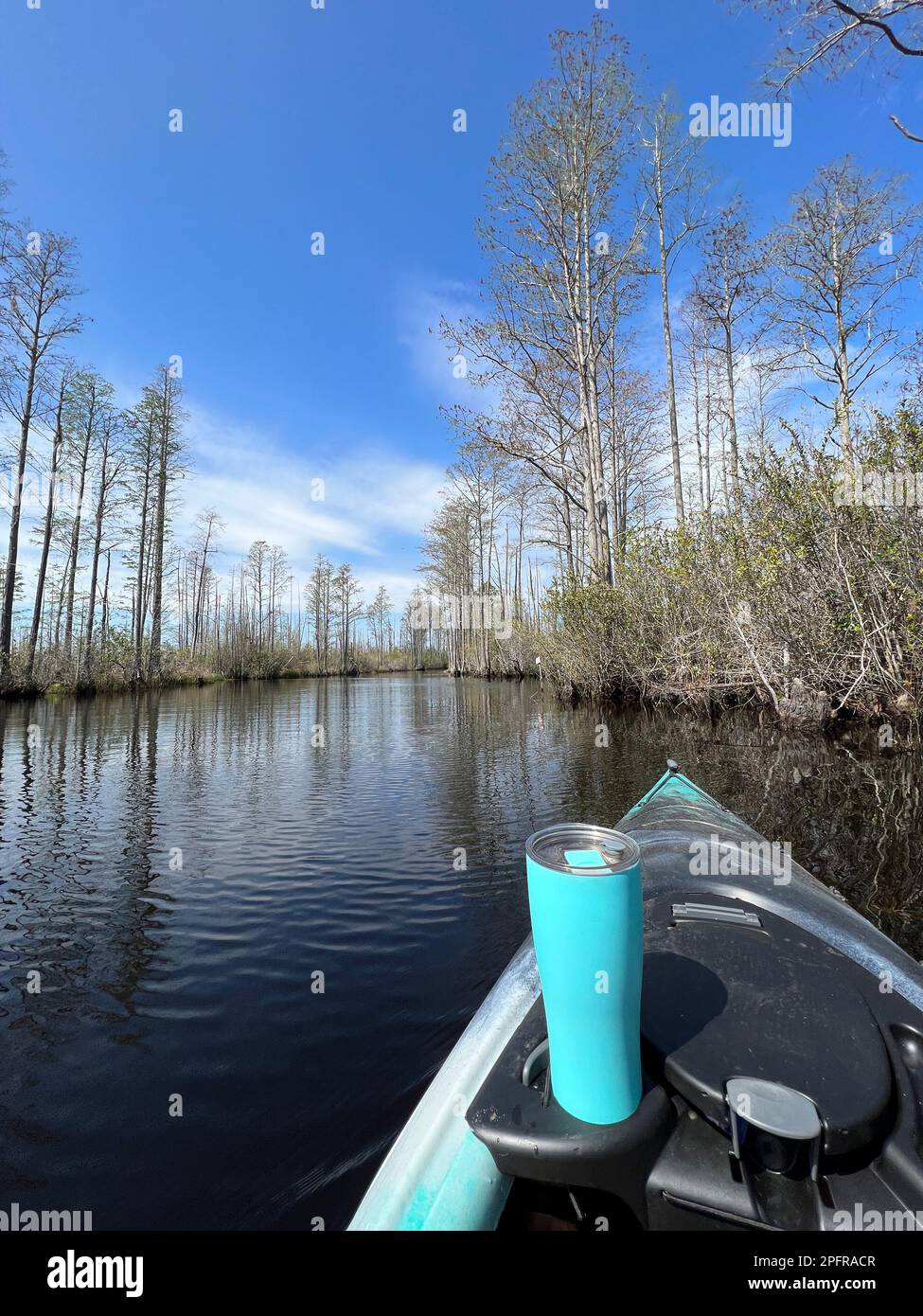 A kayaker is ready hydrate using a refillable bottle at Okefenokee ...