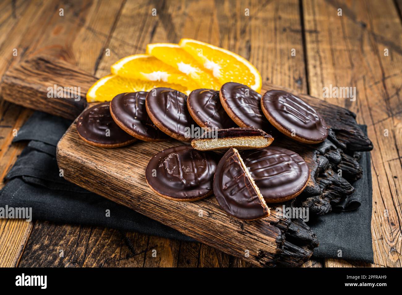 Chocolate Jaffa Cakes with Orange Flavored Marmalade. Wooden background ...